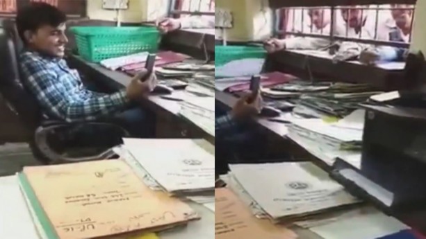 ഫയലുകൾ മാറ്റിവെച്ച് ഫോണിൽ സൊറ പറച്ചിൽ; ക്യൂ നിൽക്കുന്ന ജനങ്ങളെ ...